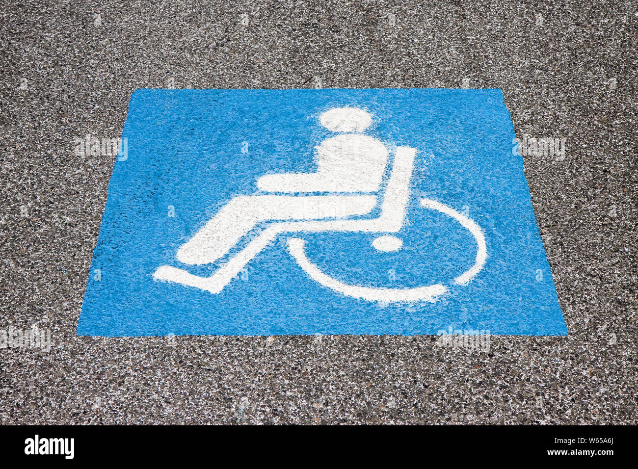 Symbol of the handicapped person painted on the asphalt Stock Photo - Alamy