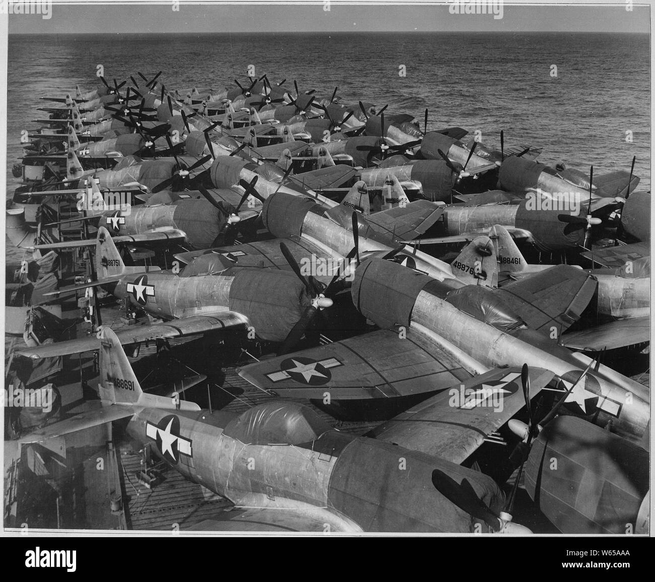Flight Deck, USS CASABLANCA. Flight deck load, aircraft, P-47NE5, aft ...