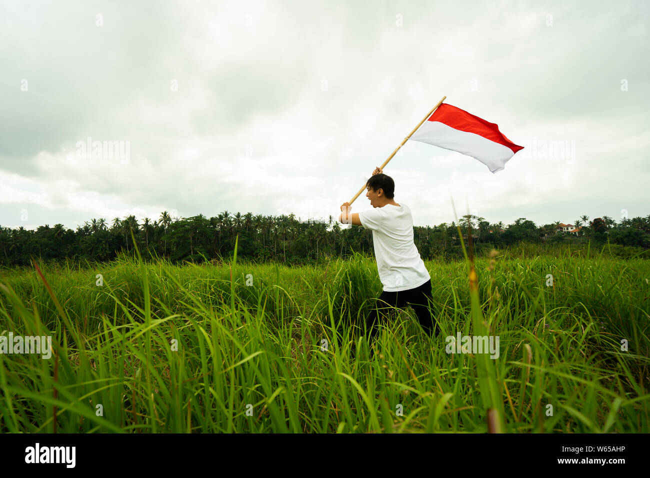 asian male with indonesian flag celebrating independence day Stock ...
