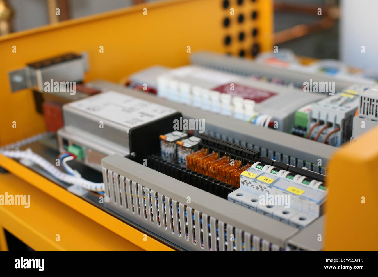 Electrical device connectors and fuses yellow chassis Stock Photo - Alamy