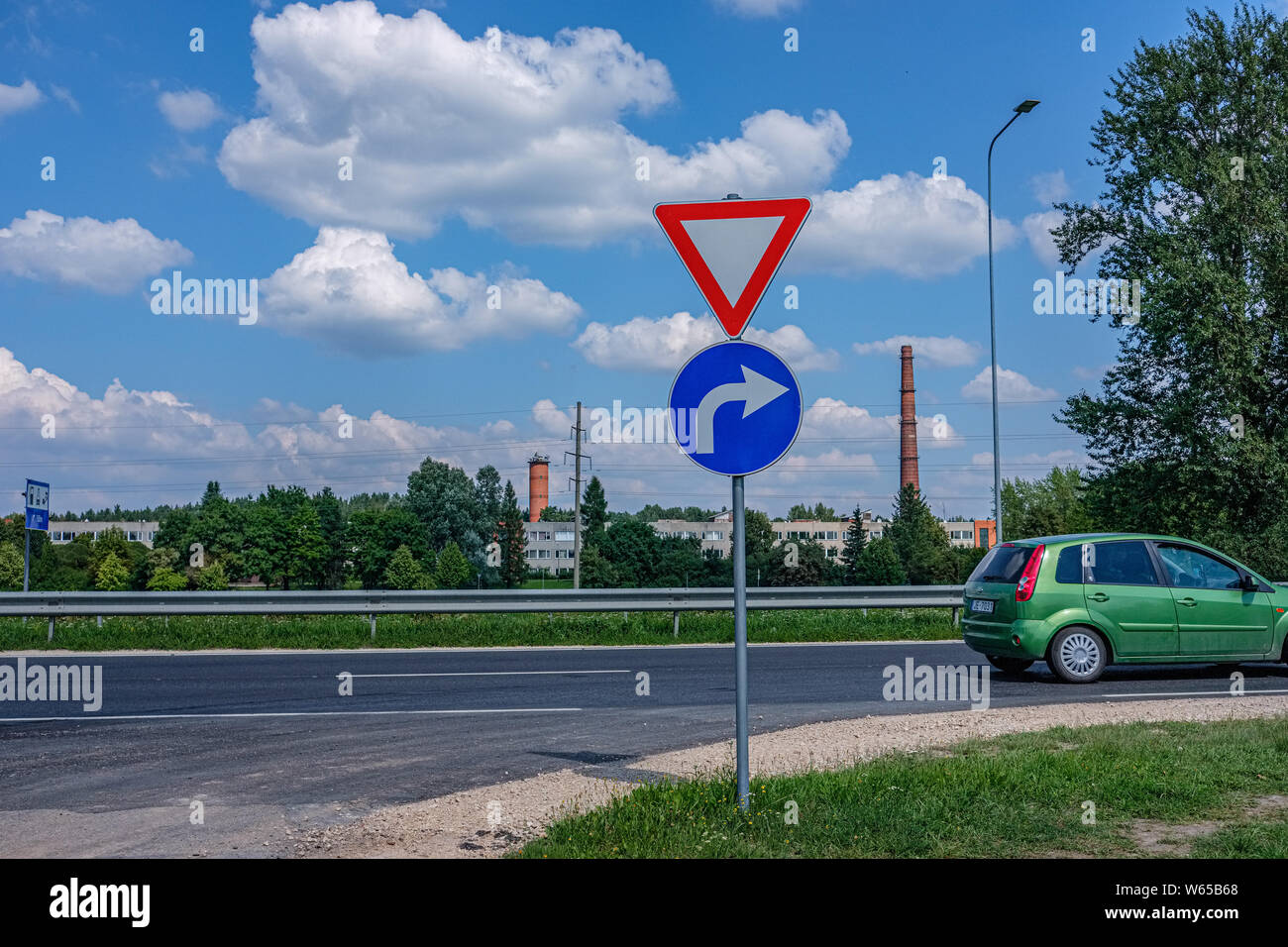 road signs showing directions on the street Stock Photo - Alamy