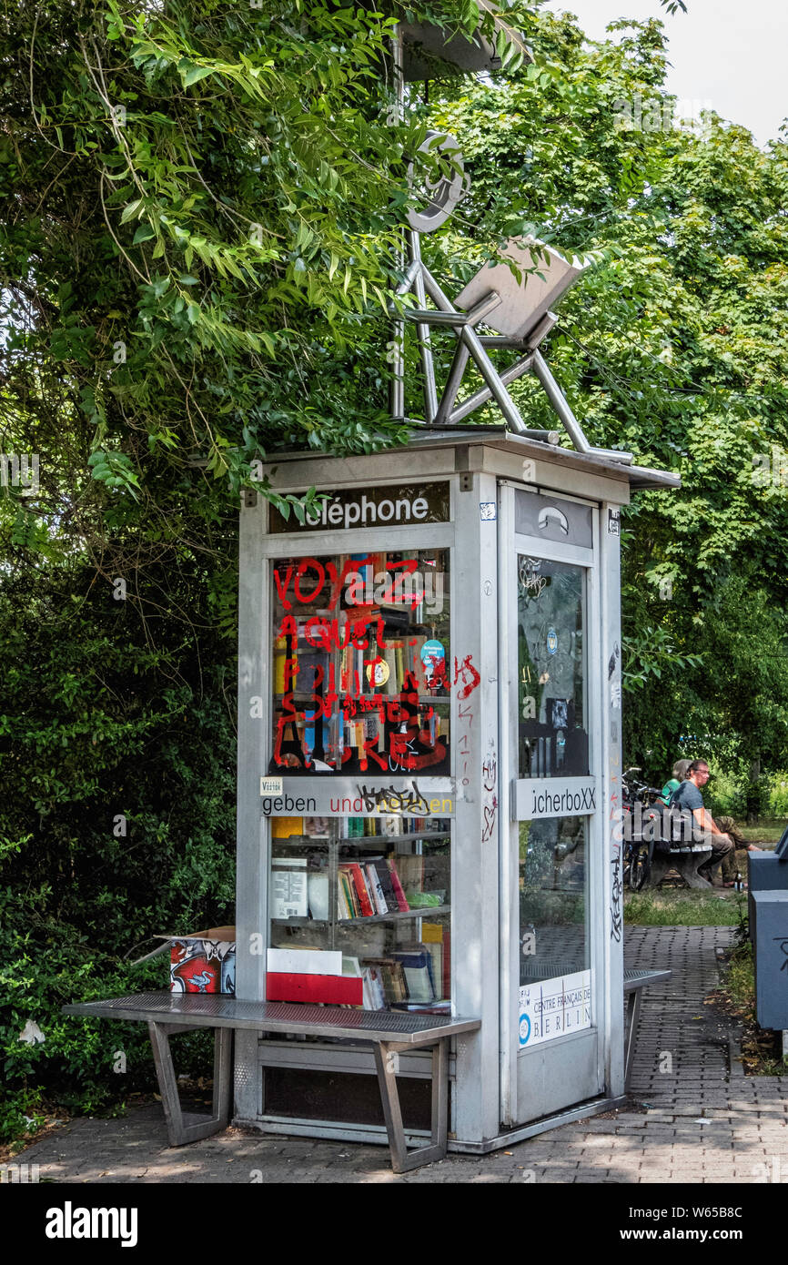 BucherboXX. Miniature lending libary in old telephone box outside the ...