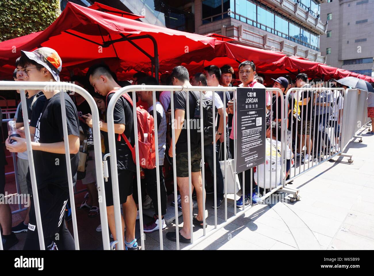 Chinese buyers queue up to buy limited editions of Jordan sneakers in ...