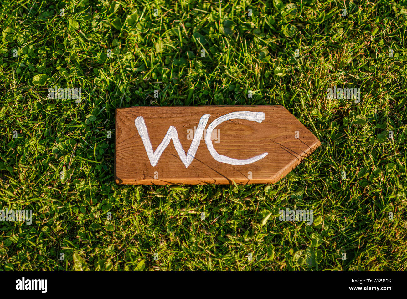 road signs showing directions on the street. wc Stock Photo - Alamy