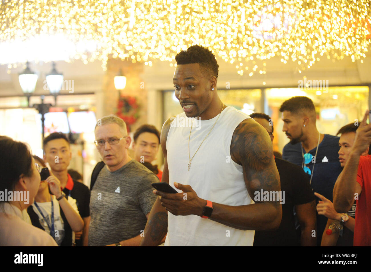 NBA star Dwight Howard of Washington Wizards visits the Hanjie Street ...