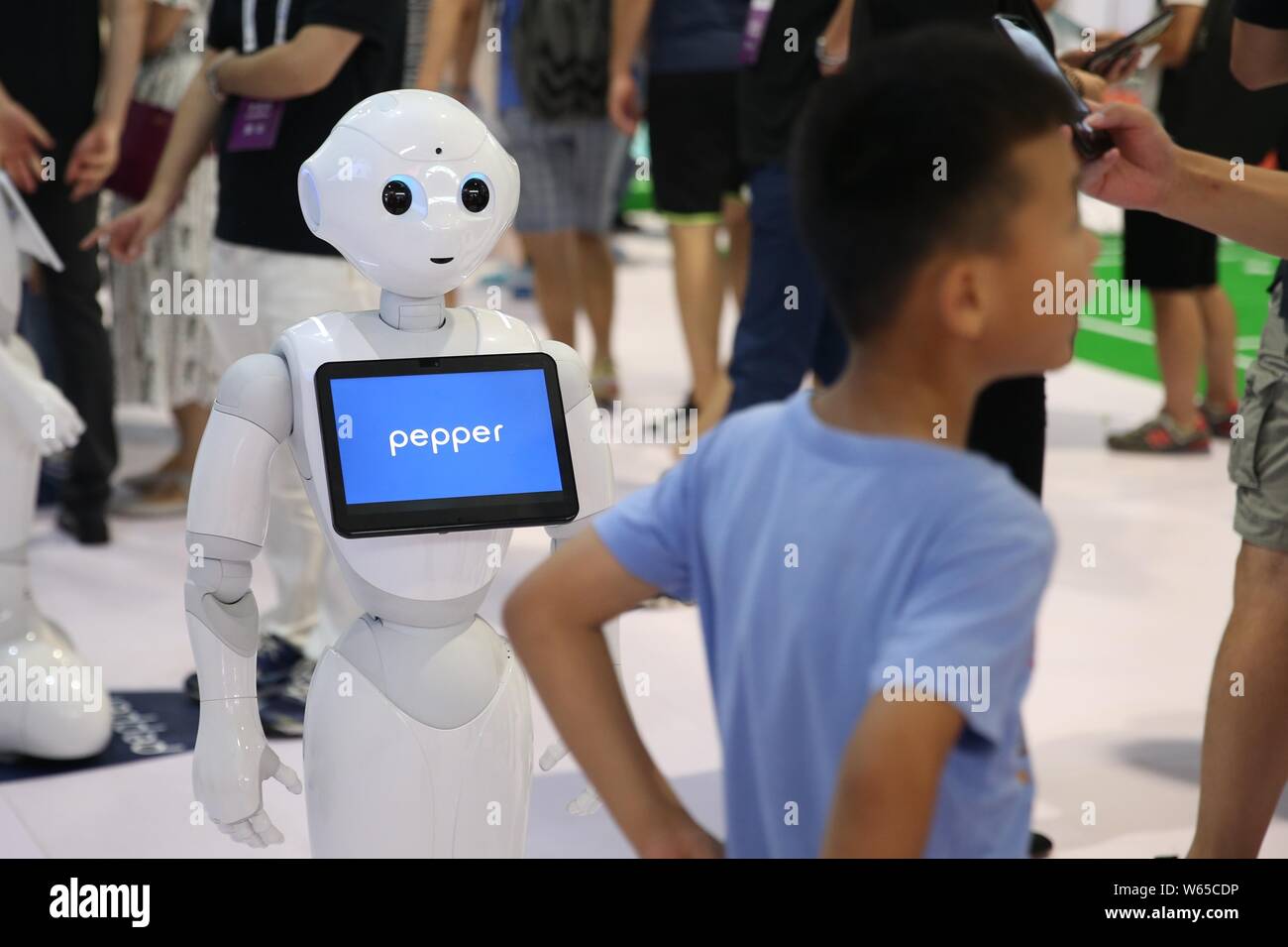 Pepper, a semi-humanoid robot manufactured by SoftBank Robotics, is on ...