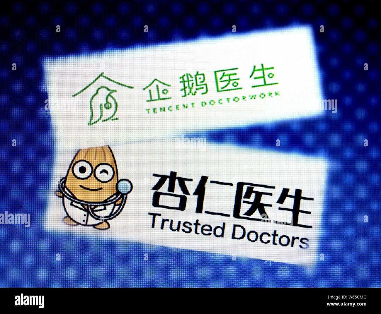 --FILE--Logos of Tencent Doctorwork, upper, and Trusted Doctors are ...