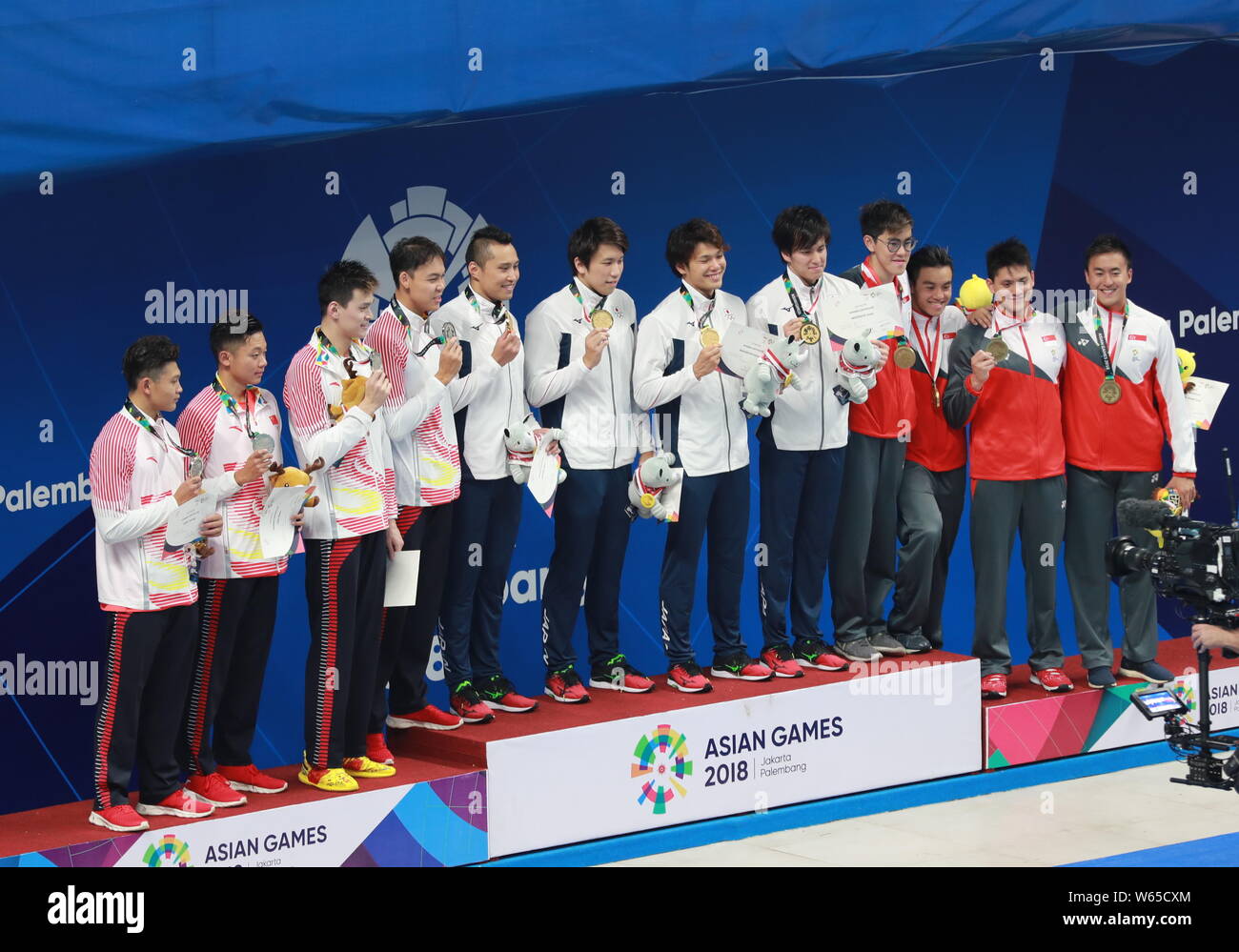 Silver medalist China's men's 4x100 freestyle relay team, gold medalist ...