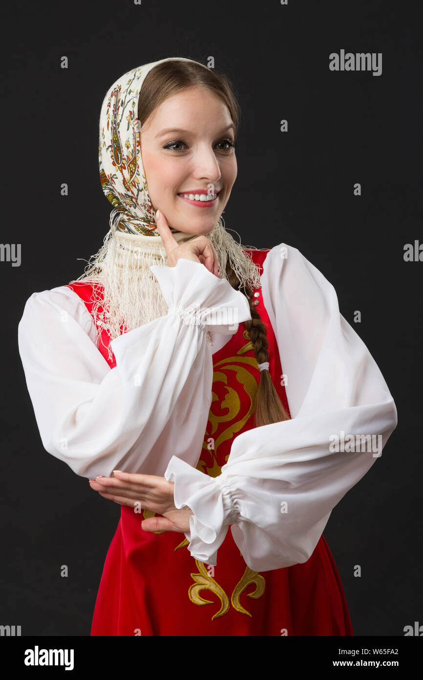 beautiful smiling caucasian girl in russian folk costume, studio ...