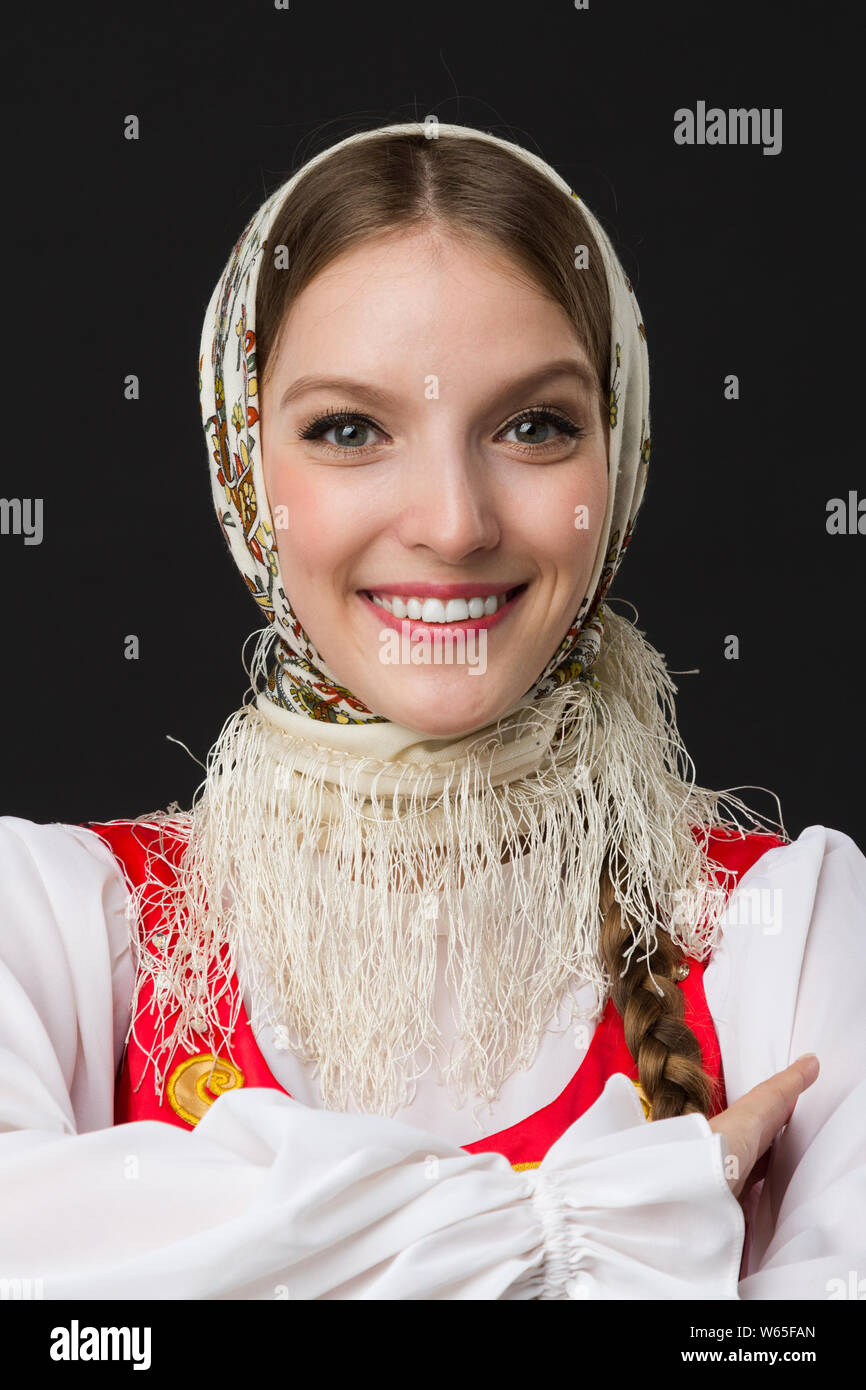beautiful smiling caucasian girl in russian folk costume, studio ...