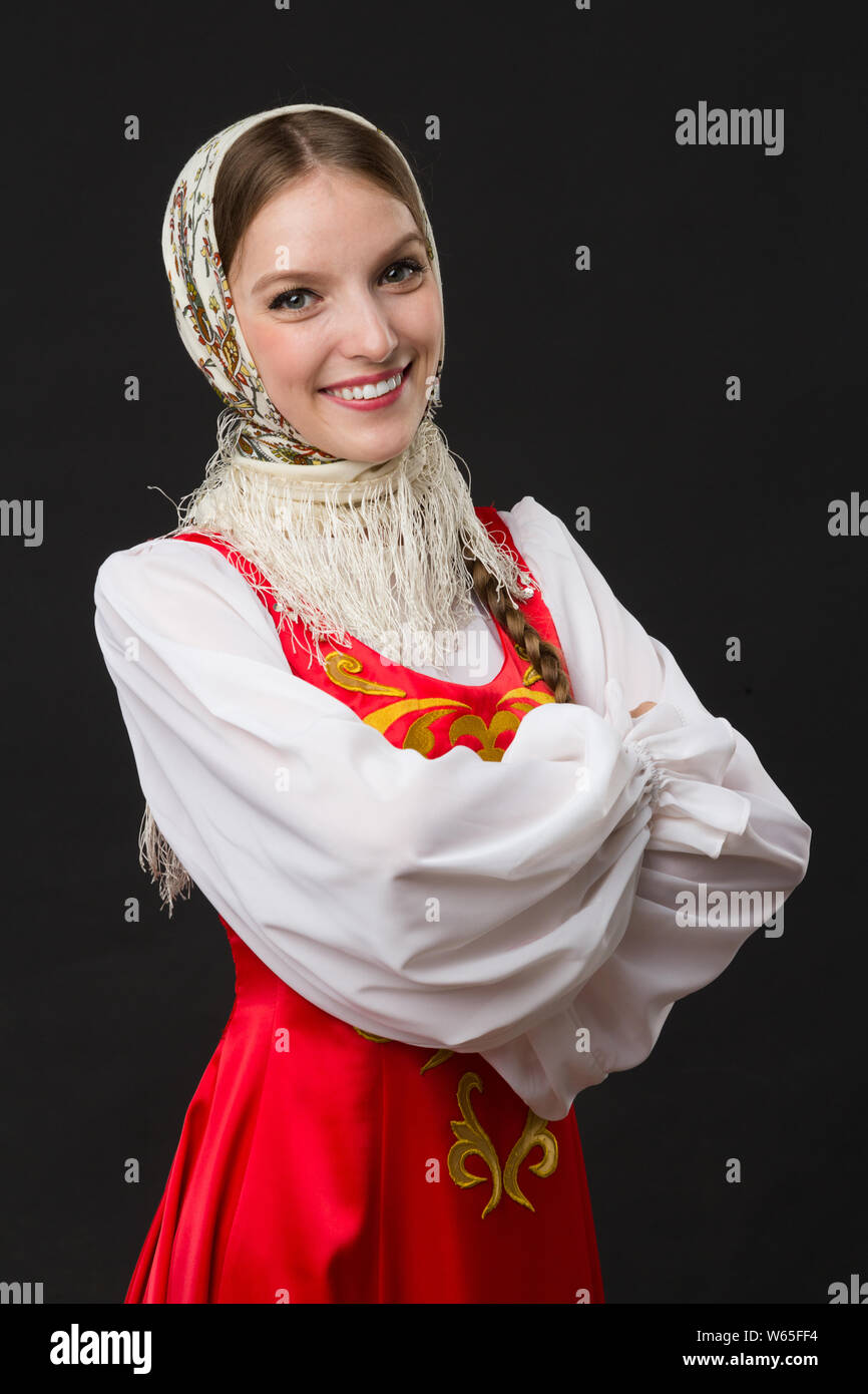 beautiful smiling caucasian girl in russian folk costume, studio ...