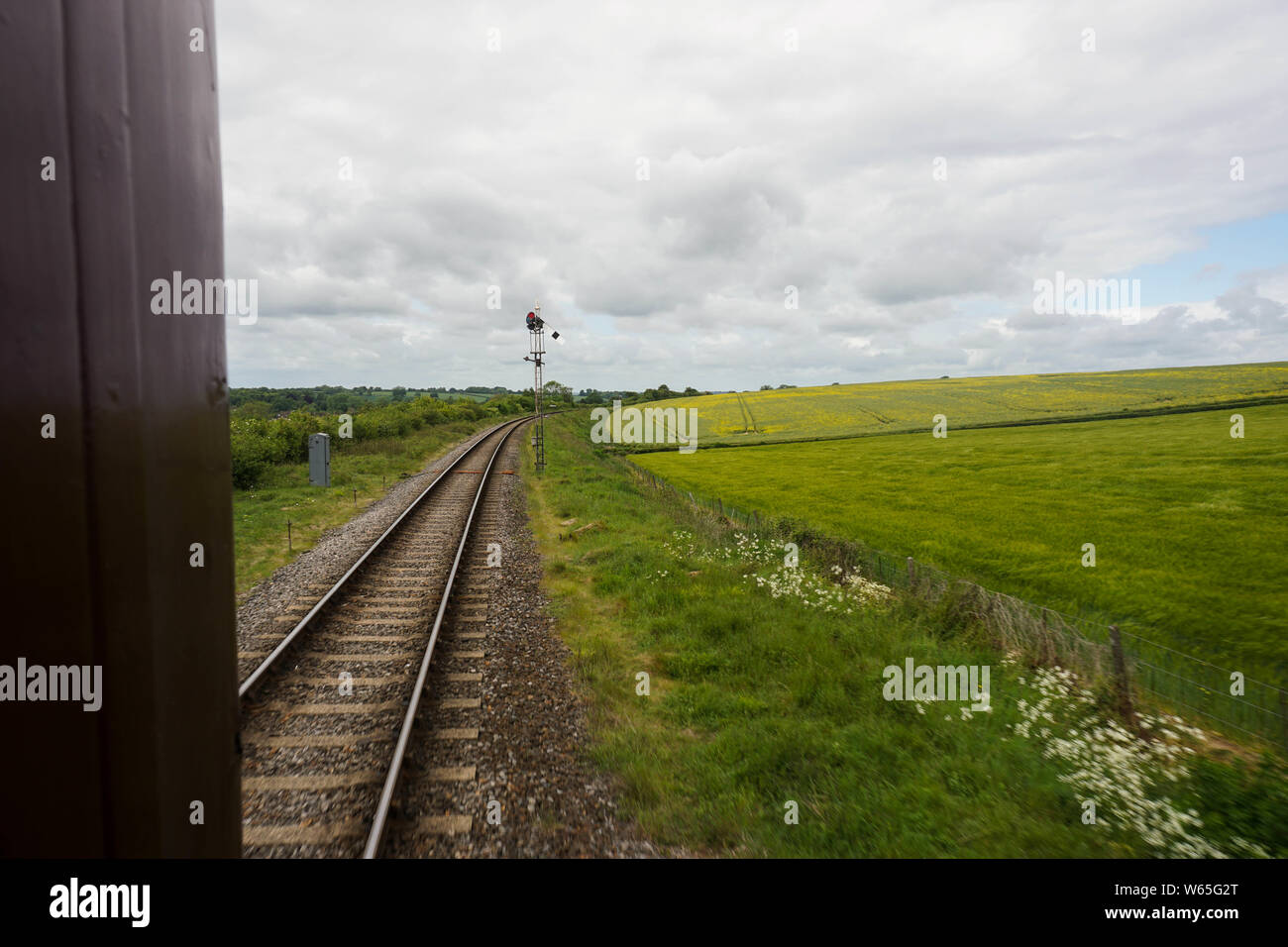A photo of railway tracks taken from the back of a steam train Stock ...