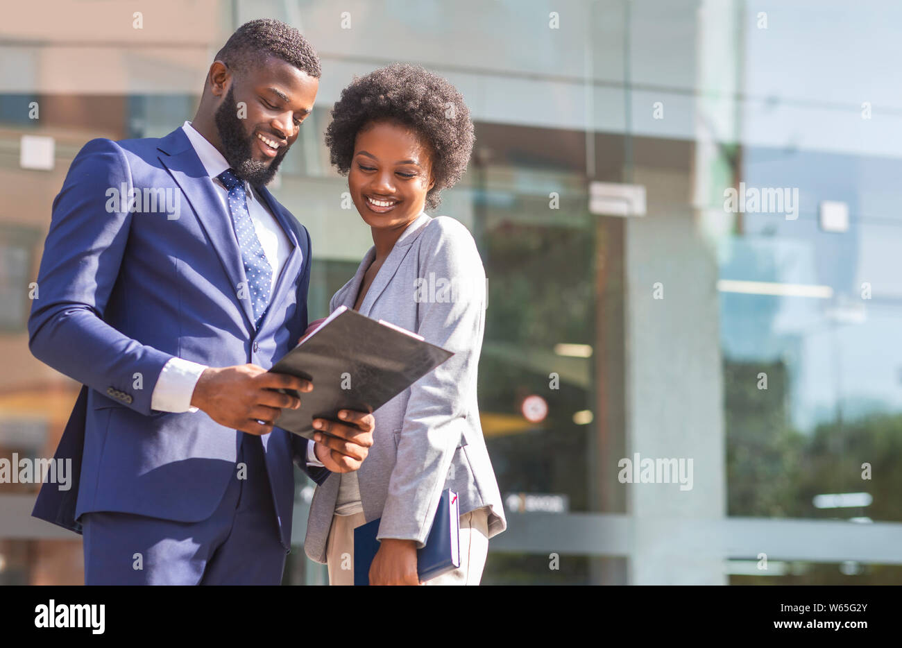 Business couple discussing documents hi-res stock photography and ...