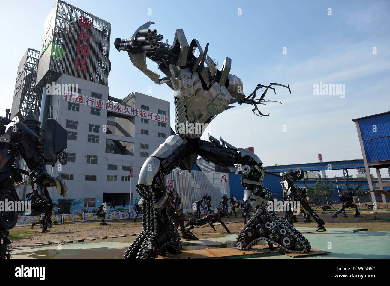 A robot statue made by Delong Steel with discarded steel parts is on ...