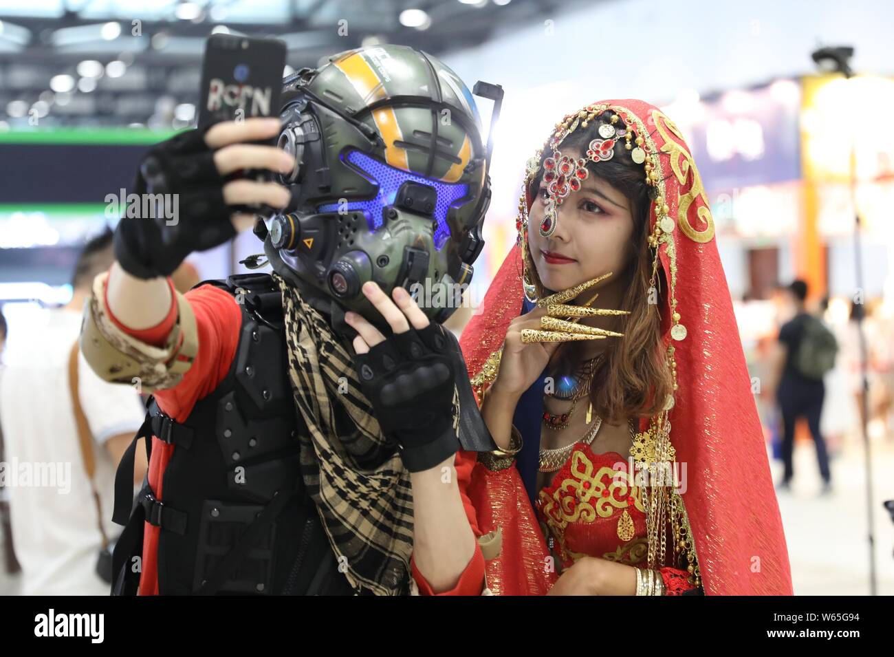 Chinese cosers dressed in cosplay costumes pose during the Beijing ...