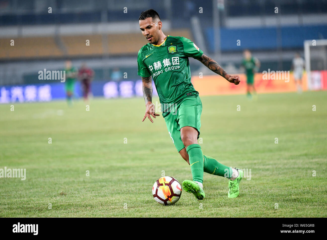 Spanish football player Jonathan Vier of Beijing Sinobo Guoan dribbles ...