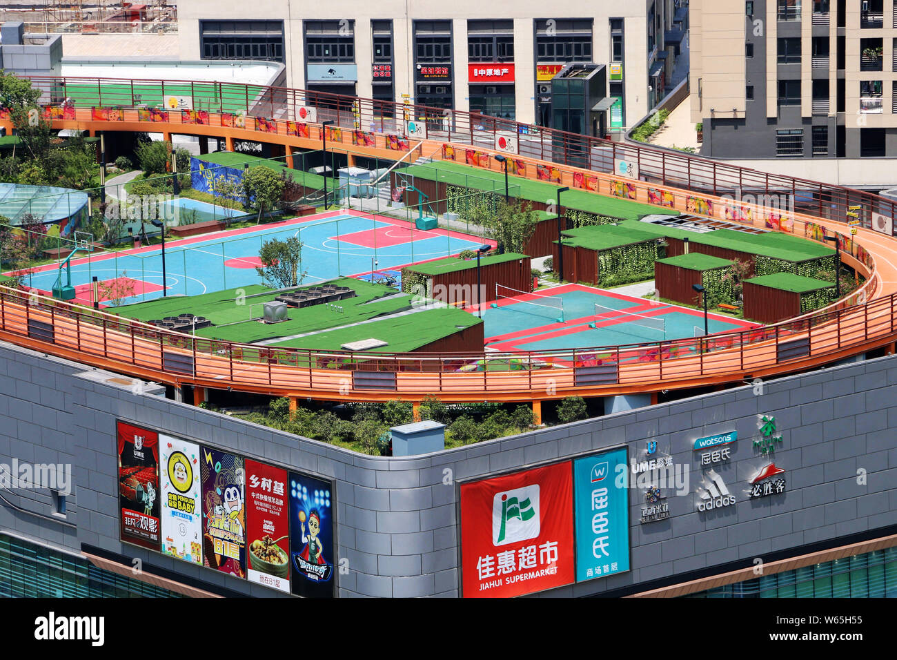 An aerial view of a sports center built on the top of a shopping mall ...