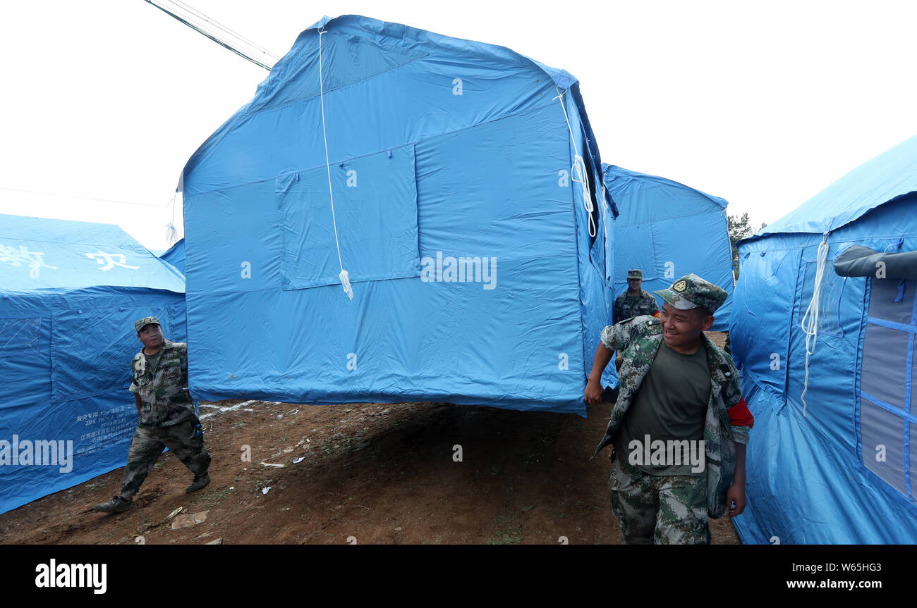 Chinese PLA (Peoples Liberation Army) soldiers set up temporary rescue ...