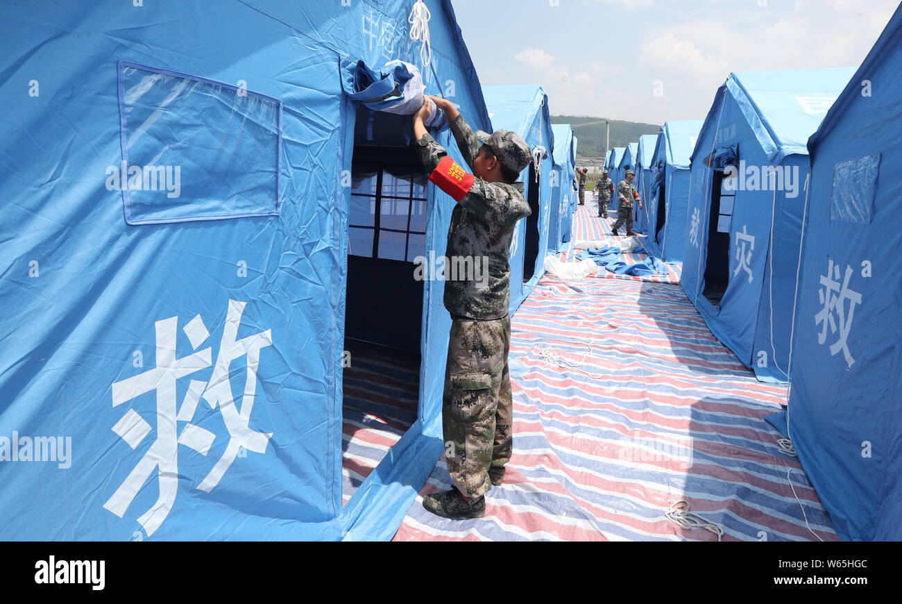 Chinese PLA (Peoples Liberation Army) soldiers set up temporary rescue ...