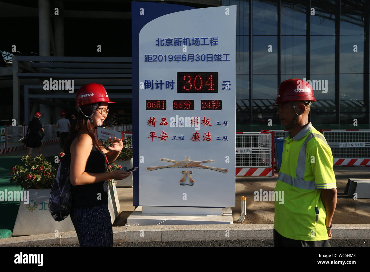 A countdown board for the construction schedule of the new Beijing ...