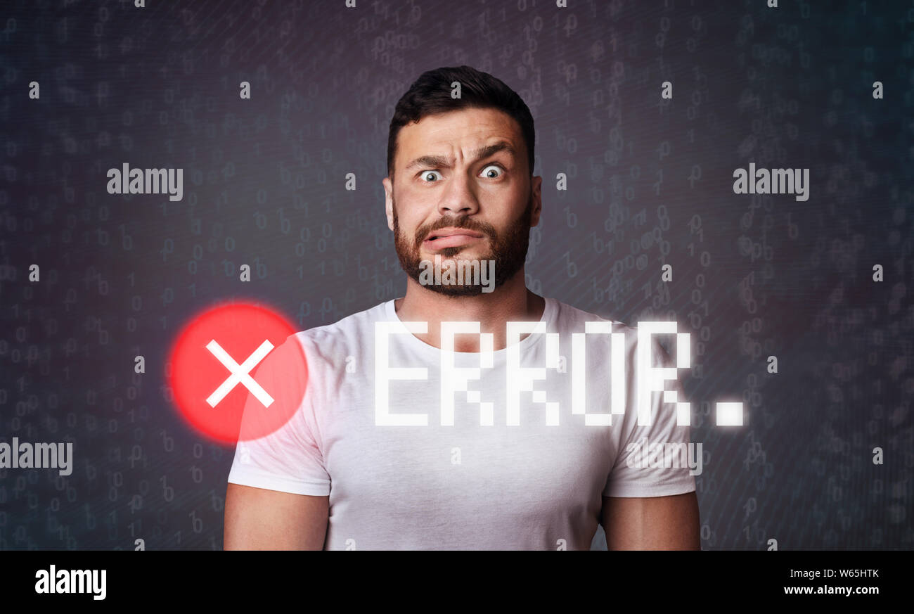 Muscular man grimacing guilty face at studio Stock Photo - Alamy