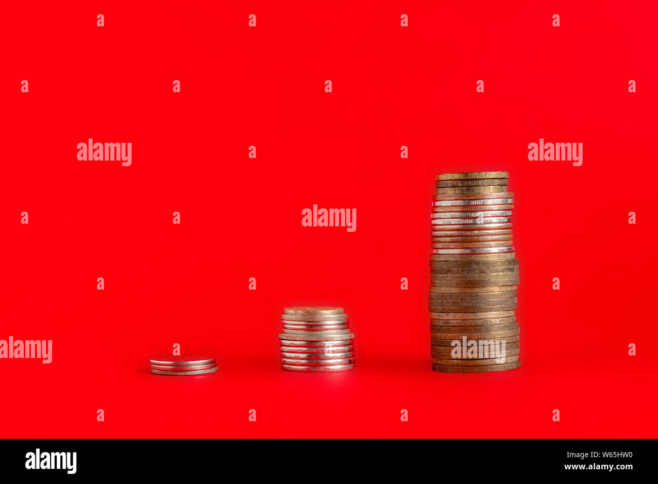 stack of cash coins showing increase graph on color surface Stock Photo ...