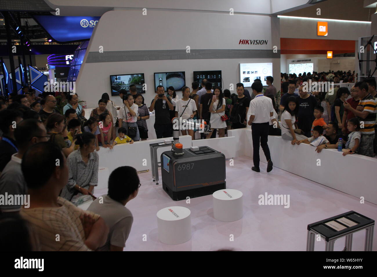 An AI-powered porter robot equipped with a mechanical arm developed by ...