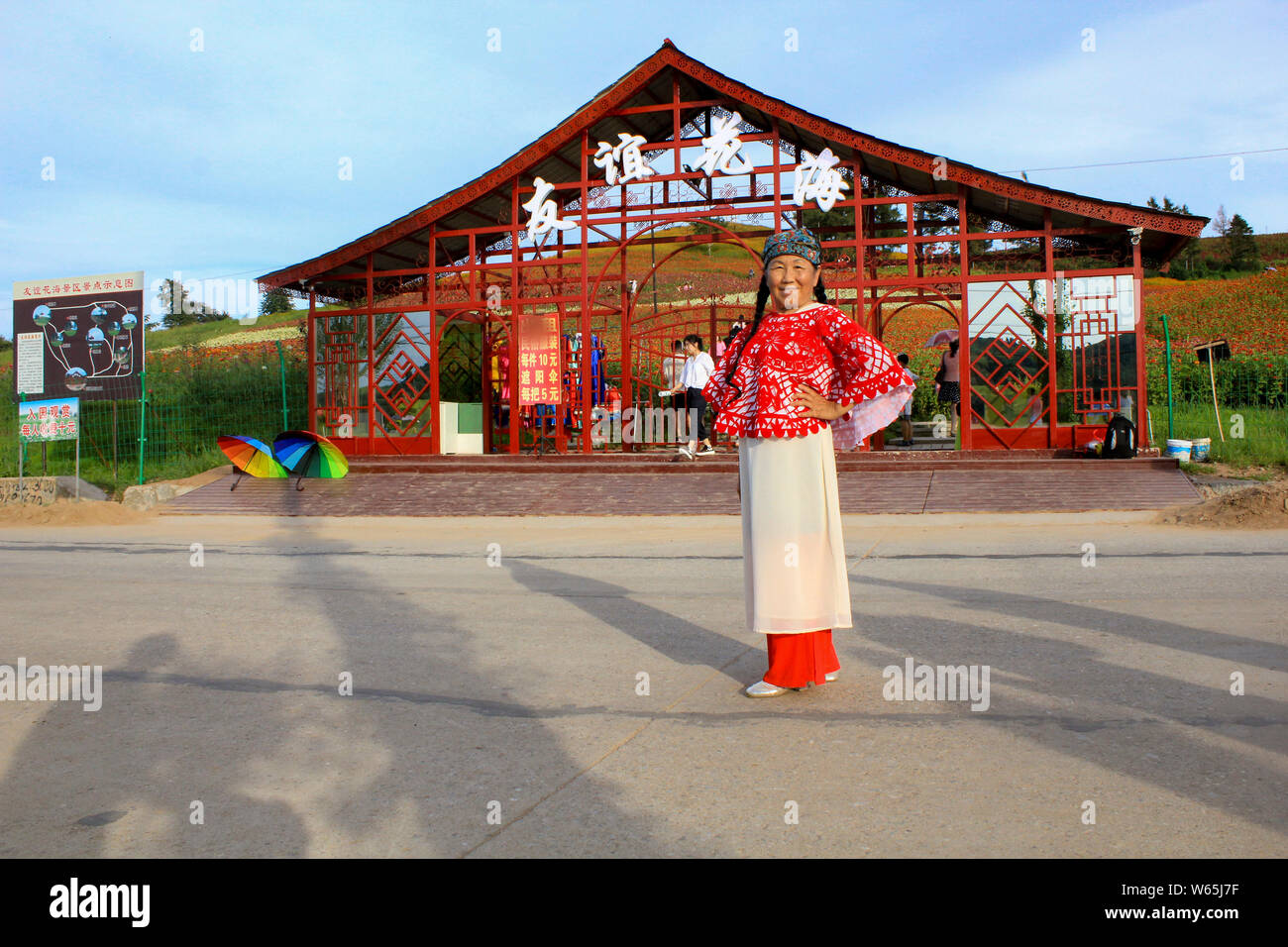 75-year-old Chinese elderly woman Zhang Guiying shows a cheongsam ...