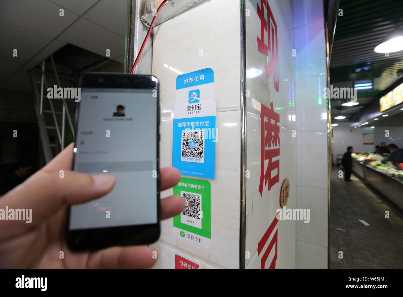 --FILE--A citizen uses his smartphone to scan the QR code of WeChat ...