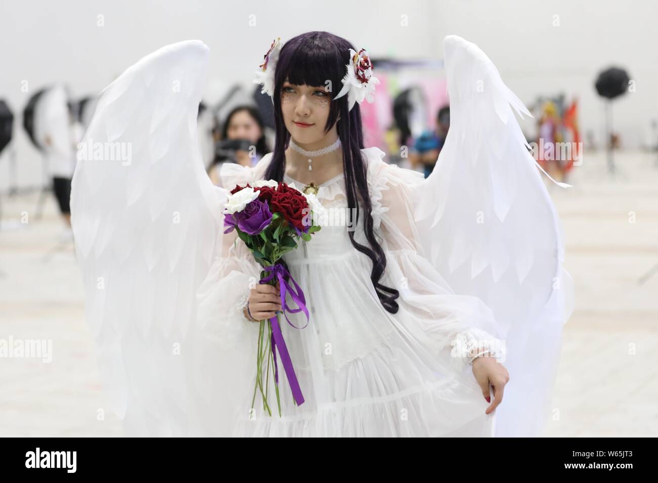 A Chinese coser dressed in cosplay costume poses during the Beijing ...