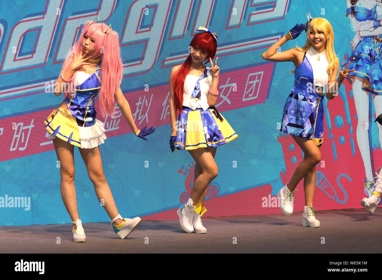 Chinese cosers dressed in cosplay costumes pose during the Beijing ...