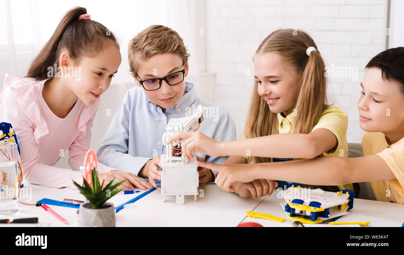 Classmates creating modern robots at stem class Stock Photo - Alamy