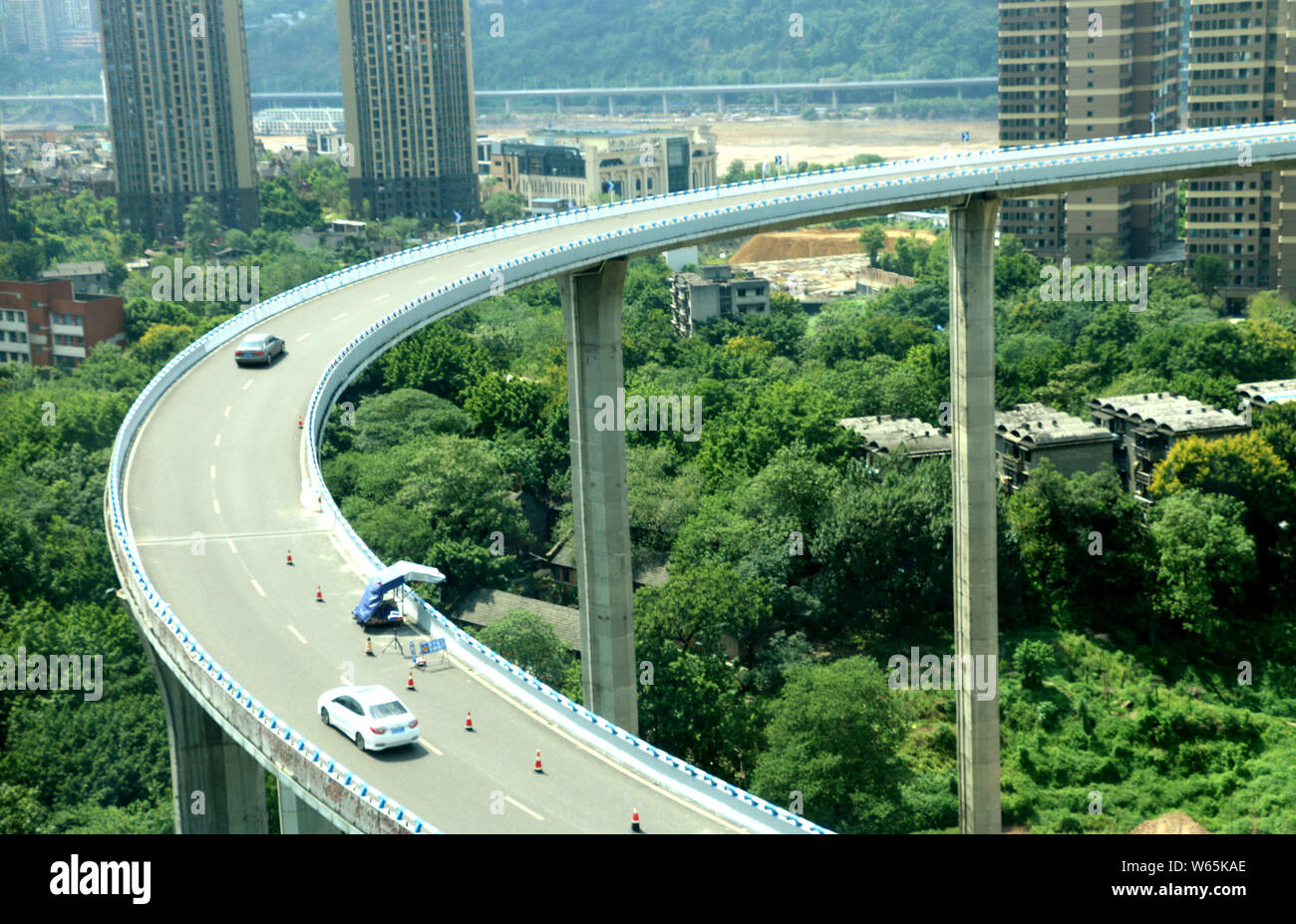 Cars drive on China's tallest highway interchange, Sujiaba Interchange ...