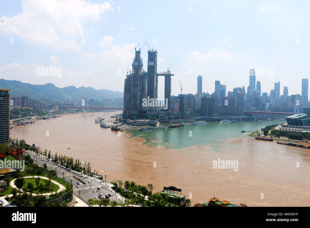 In this aerial view, boats shuttle back and forth on the confluence ...