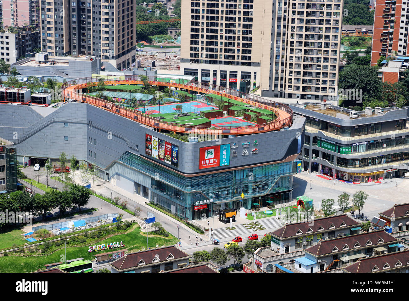 An aerial view of a sports center built on the top of a shopping mall ...