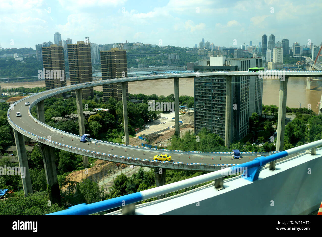 Cars drive on China's tallest highway interchange, Sujiaba Interchange ...