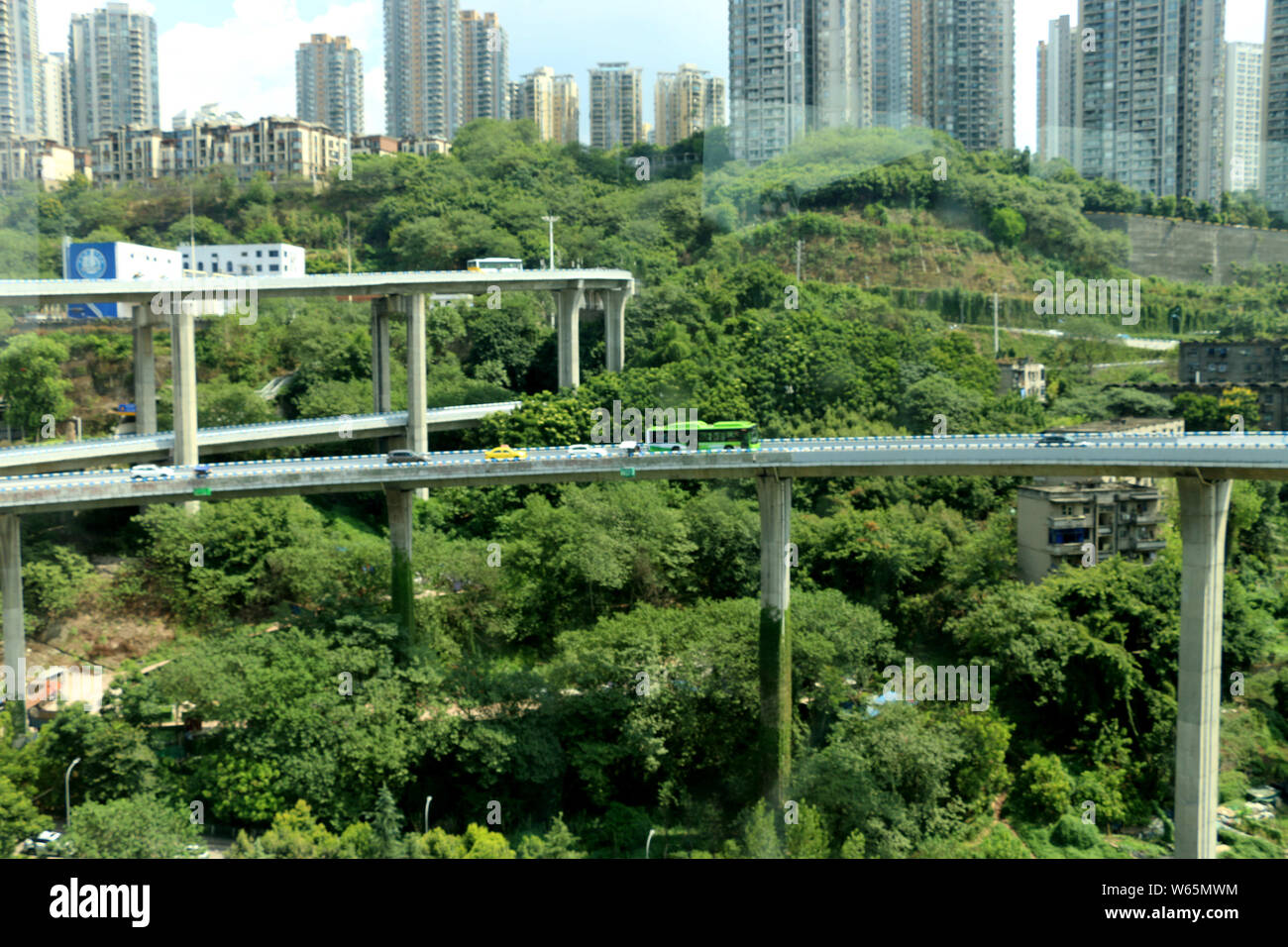 Cars drive on China's tallest highway interchange, Sujiaba Interchange ...