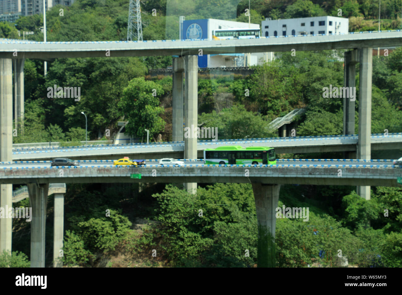 Cars drive on China's tallest highway interchange, Sujiaba Interchange ...