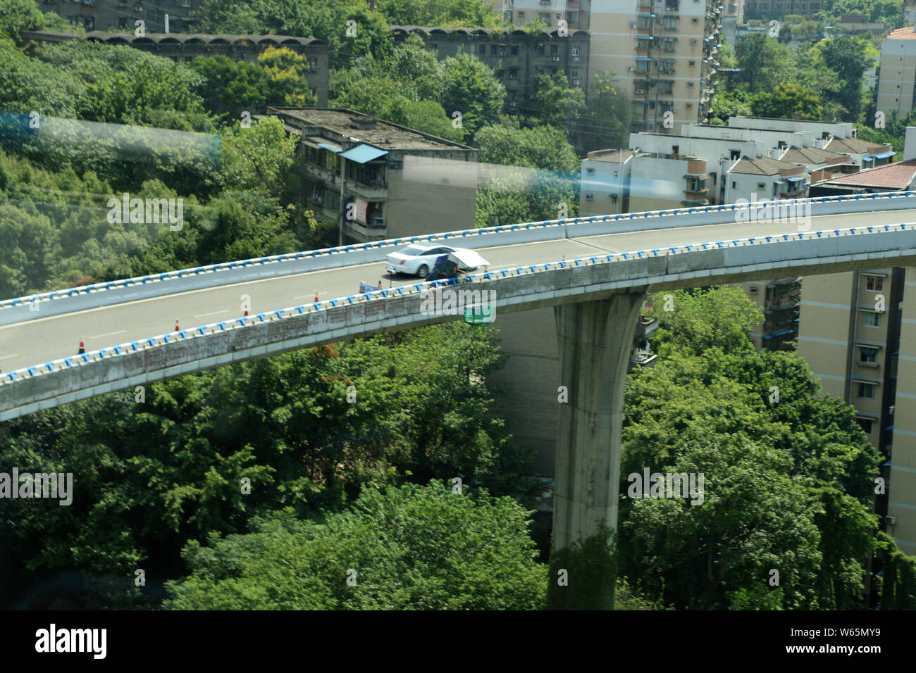 Cars drive on China's tallest highway interchange, Sujiaba Interchange ...