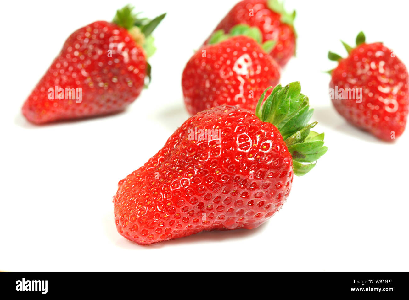 Strawberries isolated over white background Stock Photo - Alamy