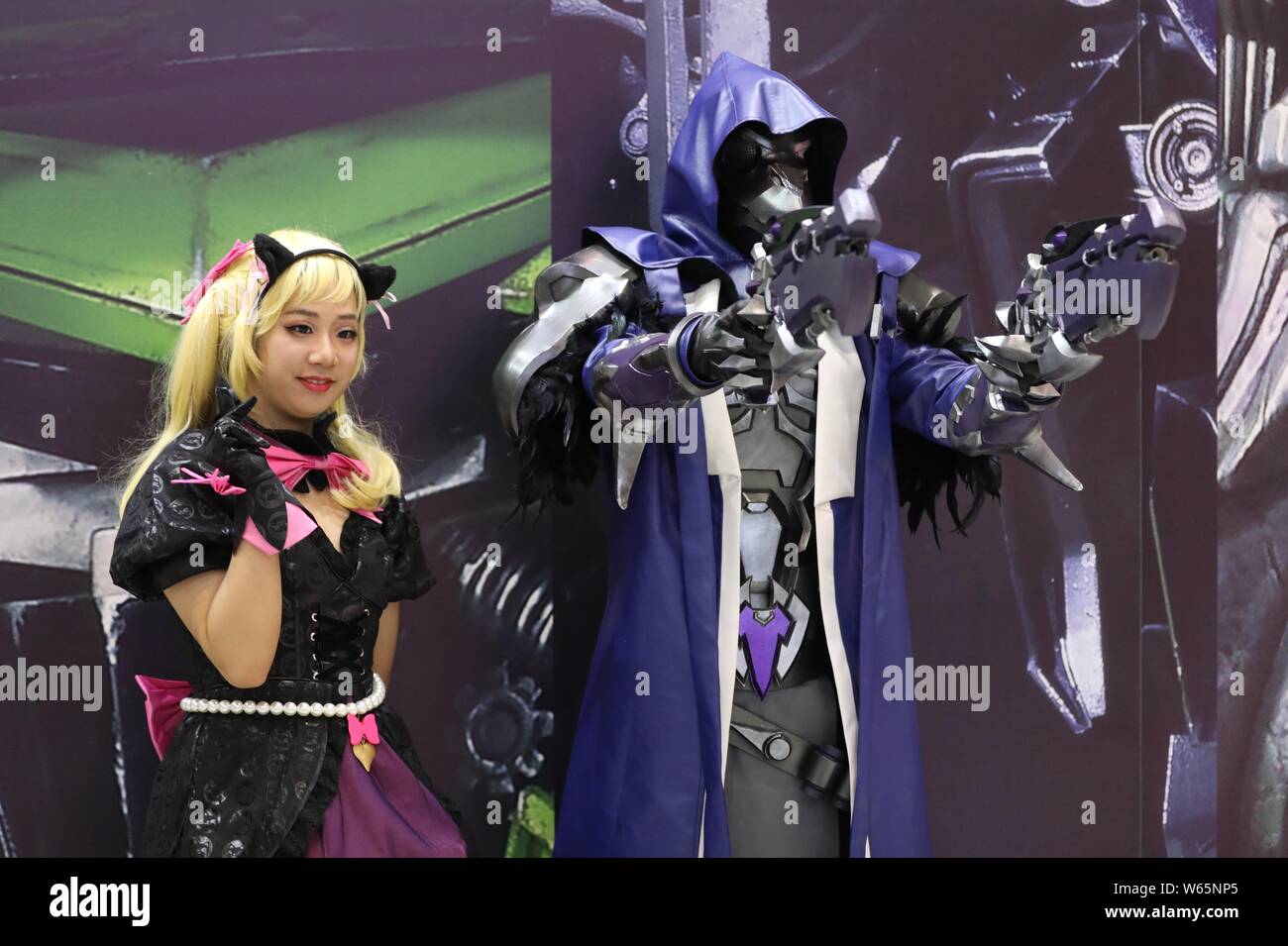 Chinese cosers dressed in cosplay costumes pose during the Beijing ...