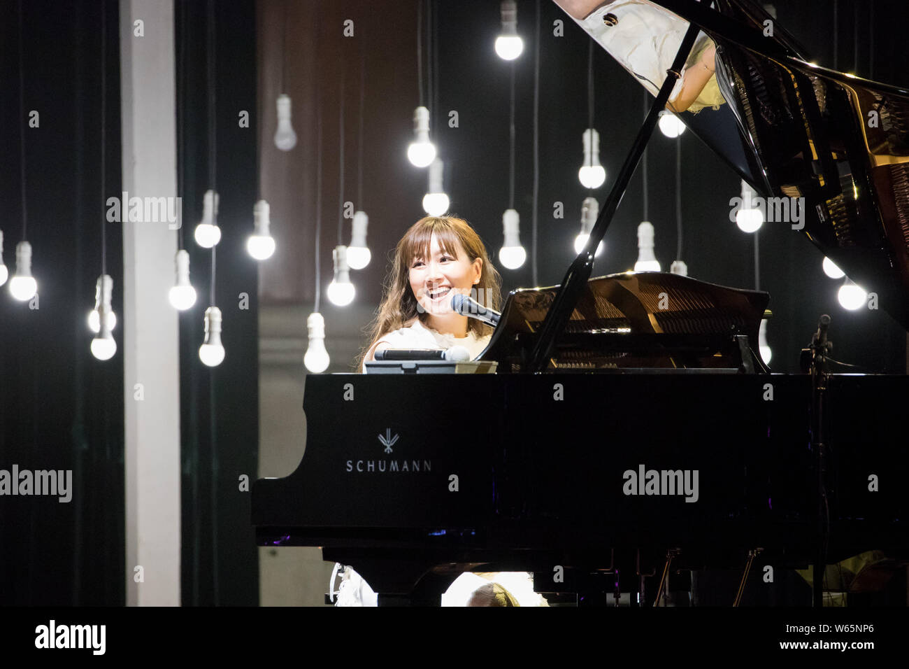 Japanese singer Ai Otsuka performs during a concert in Guangzhou city ...