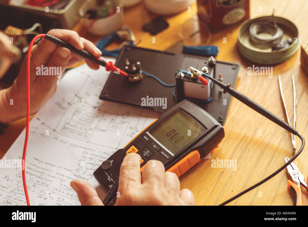 process of making electrical measurements with multimeter, testing the ...