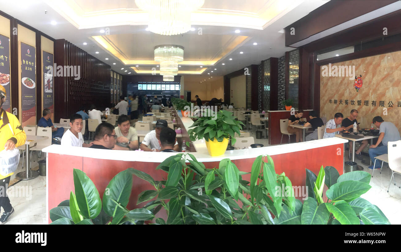 Diners are seen at the head branch of a chain noodle shop that sells ...