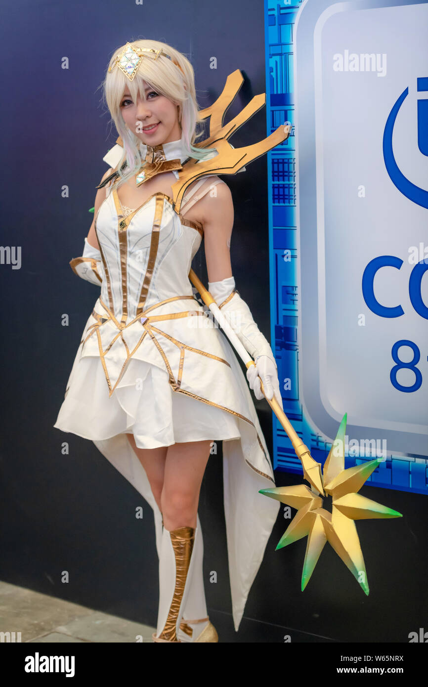 A Chinese showgirl, dressed in cosplay costume, poses during the 16th ...