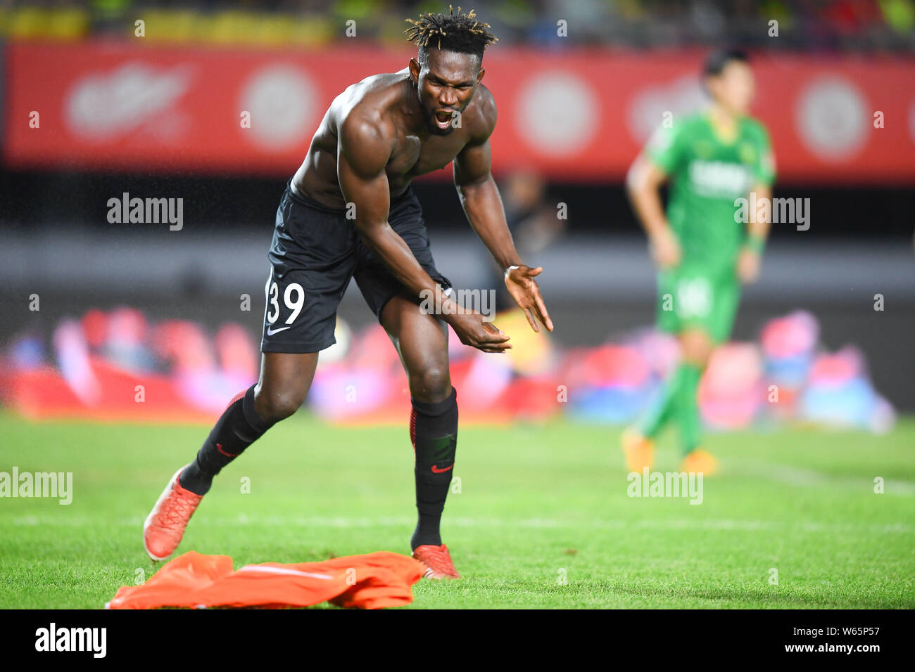 Senegalese football player Makhete Diop of Beijing Renhe celebrates ...