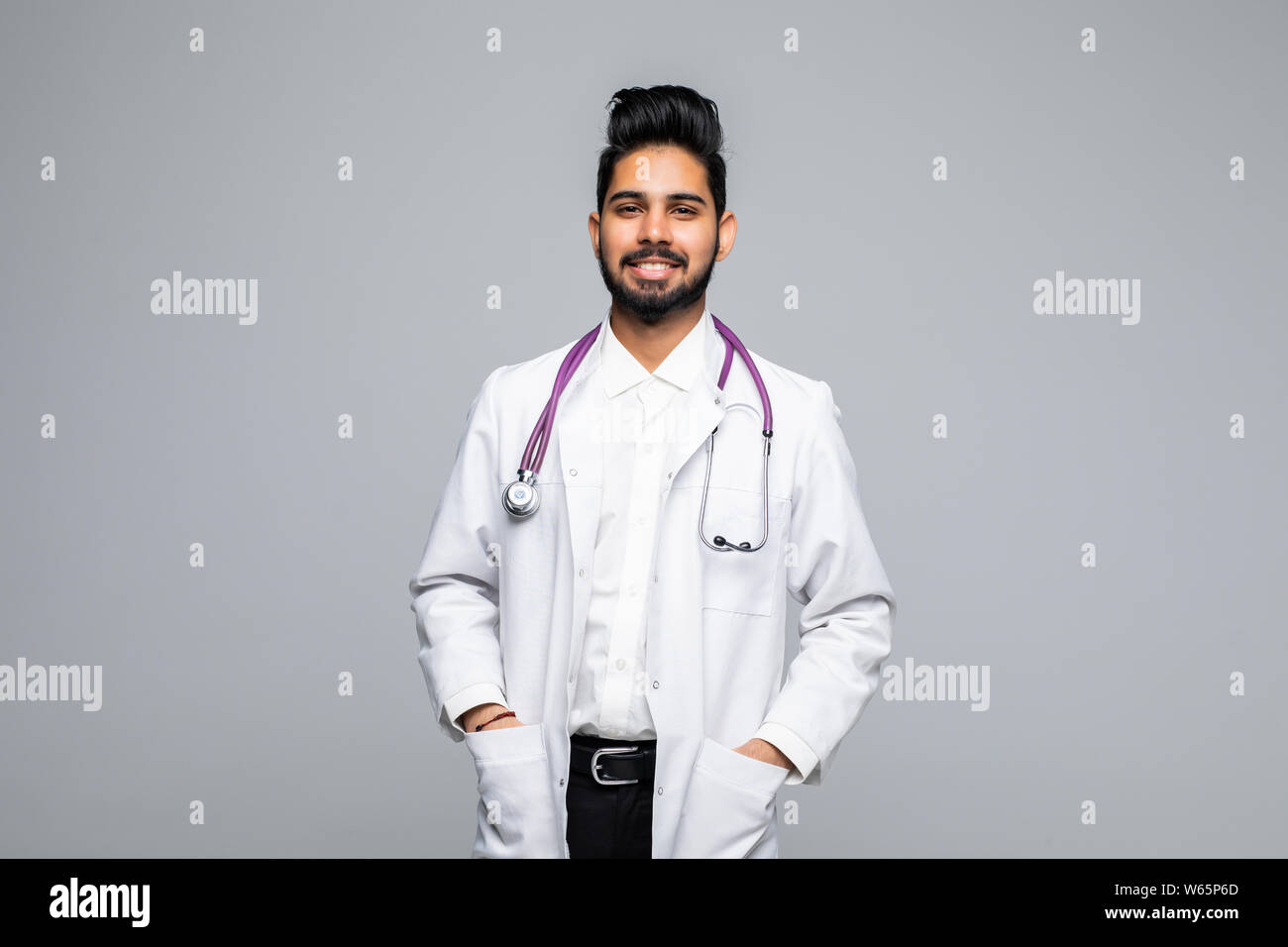 Male Indian doctor wearing a white coat and stethoscope. Isolated on ...