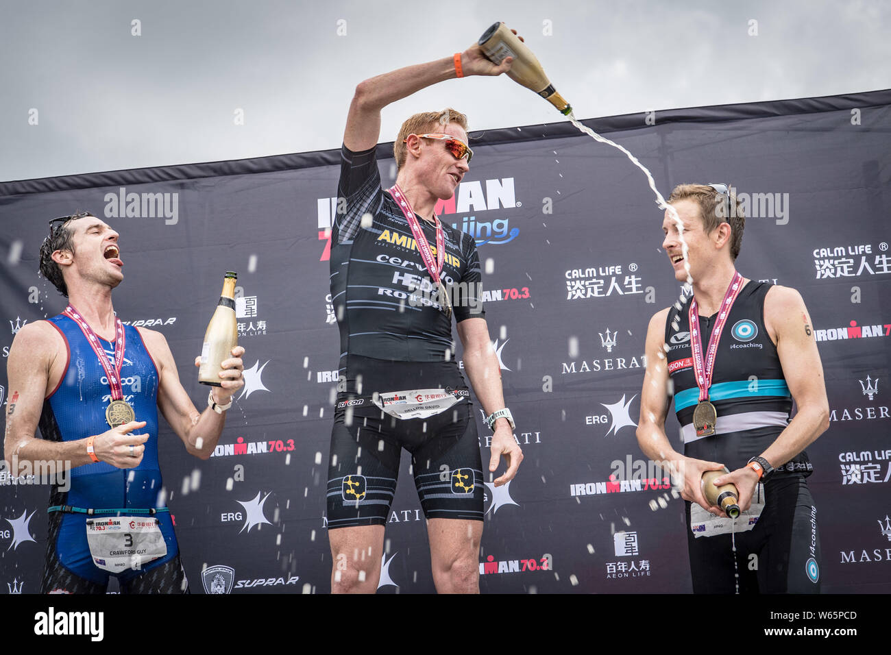 (From left) First runner-up Guy Crawford of New Zealand, winner David ...