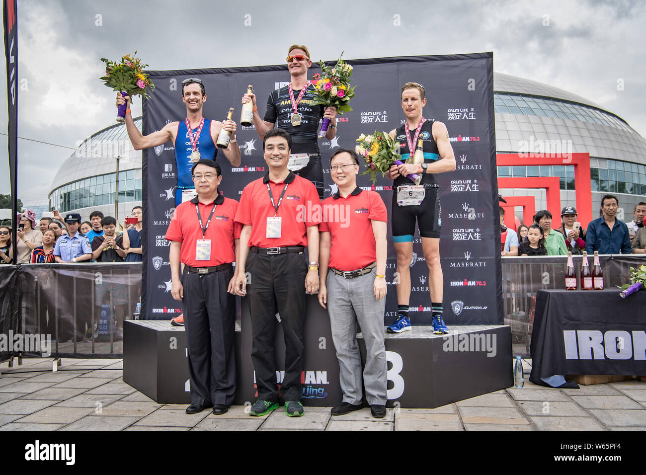 (From left) First runner-up Guy Crawford of New Zealand, winner David ...