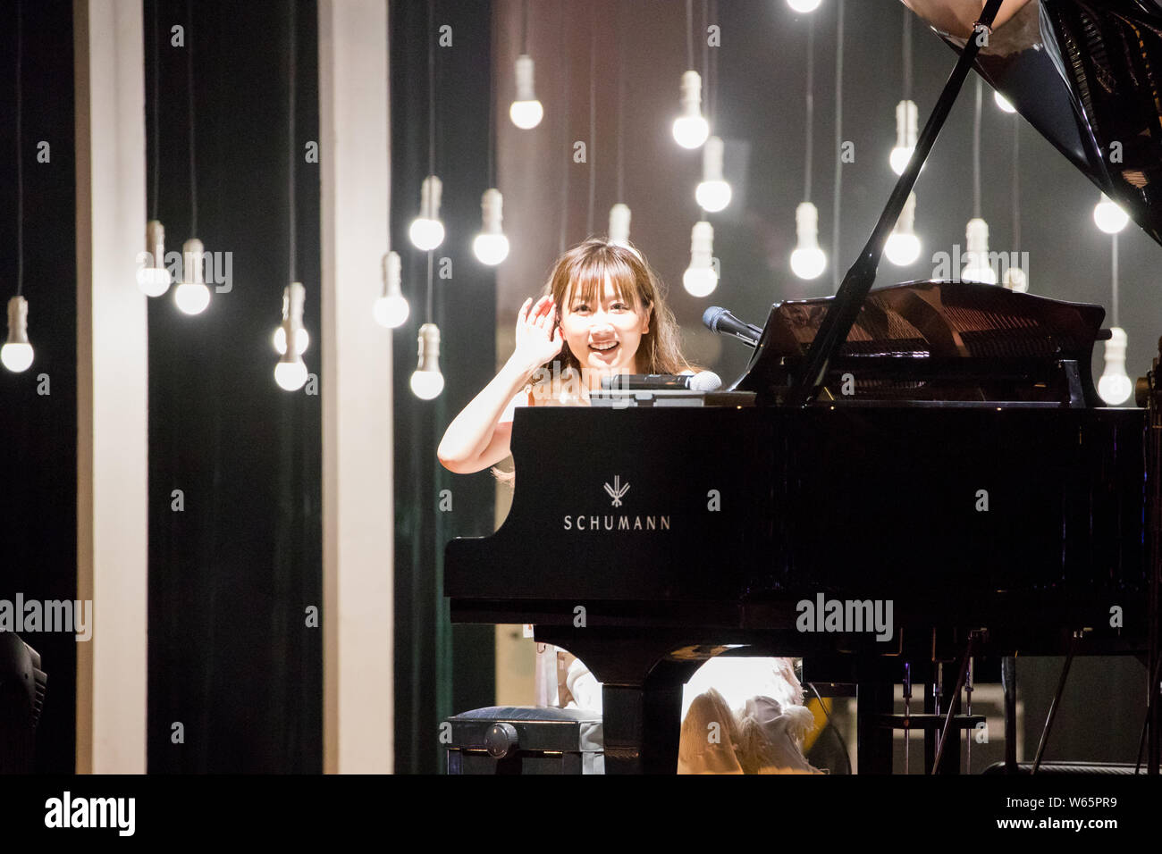 Japanese singer Ai Otsuka performs during a concert in Guangzhou city ...